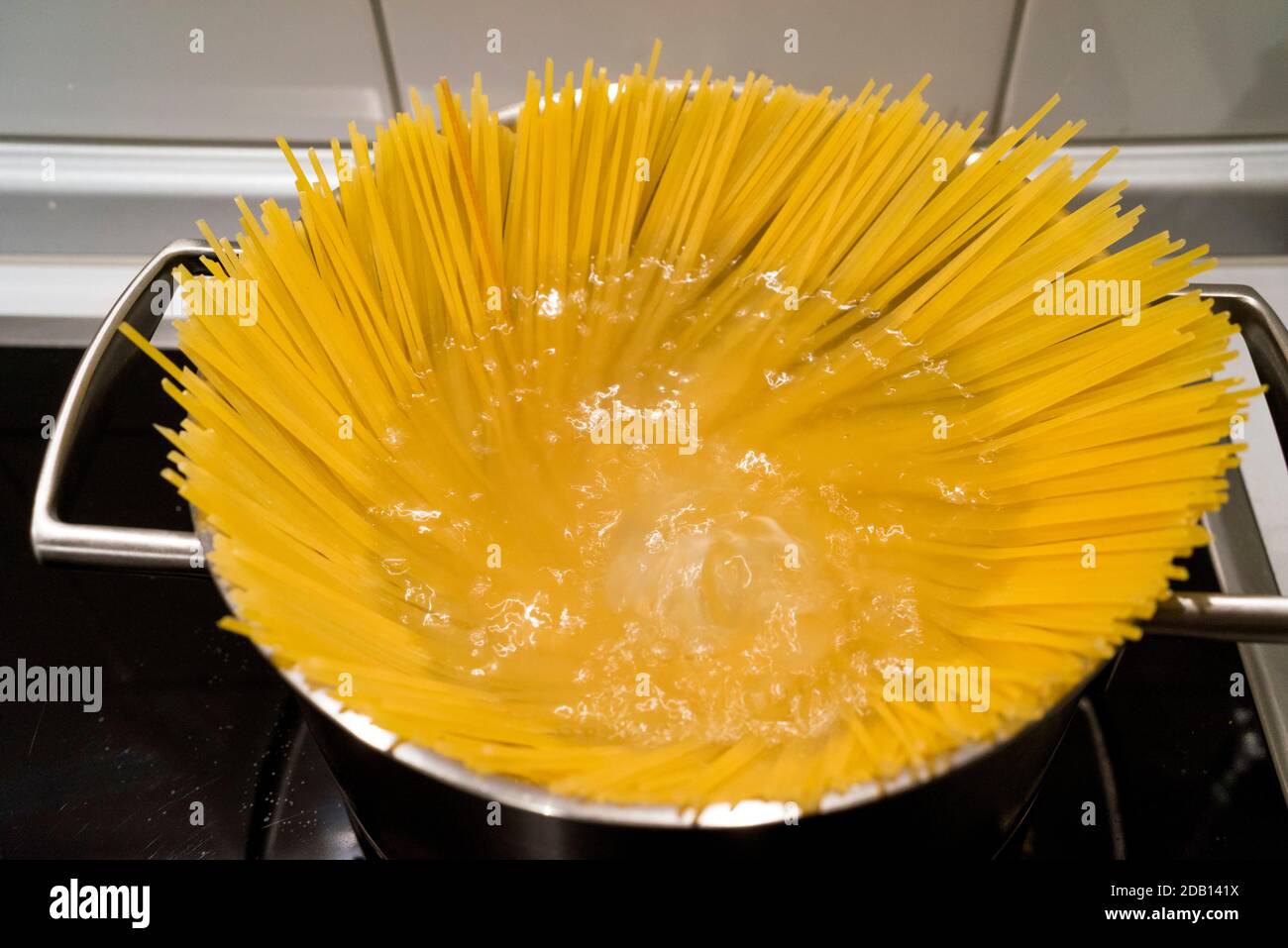 Spaghetti being cooked Stock Photo - Alamy