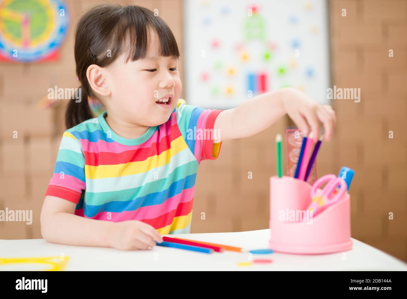 young girl practice drawing different shapes for homeschooling Stock ...