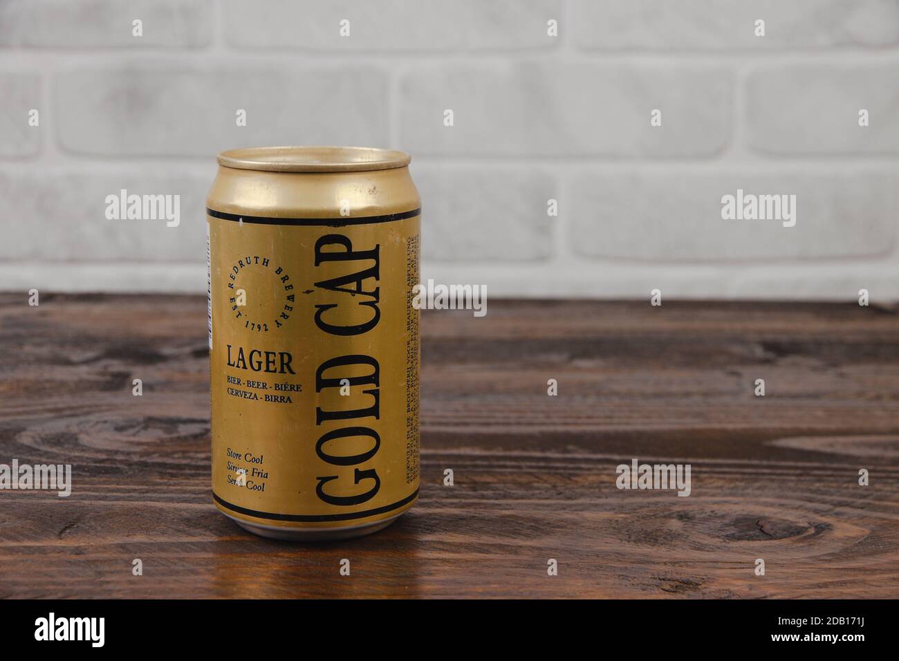 An old aluminium can of Redruth brewery beer against the brick wall ...