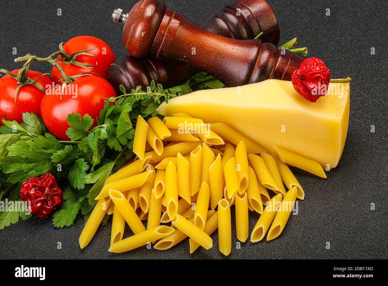 Raw penne rigate with vegetables for cooking Stock Photo - Alamy