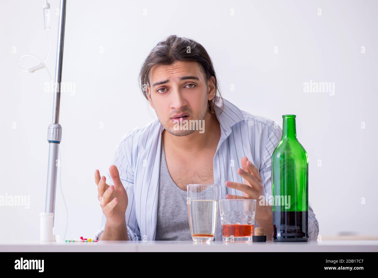 Man in alcohol addiction treatment concept Stock Photo - Alamy