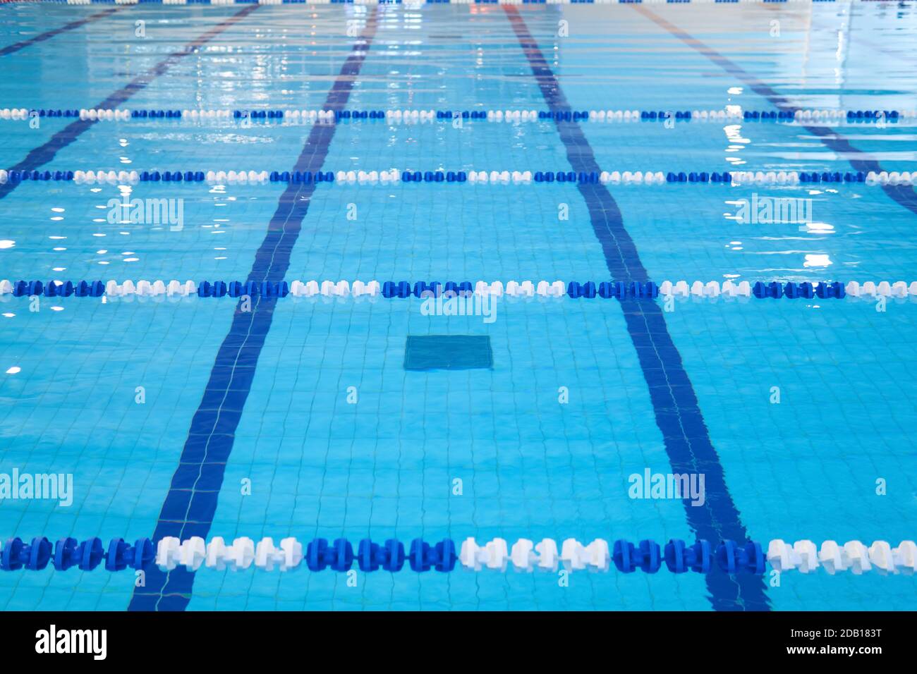 background - fragment of the competition pool with blue water and ...