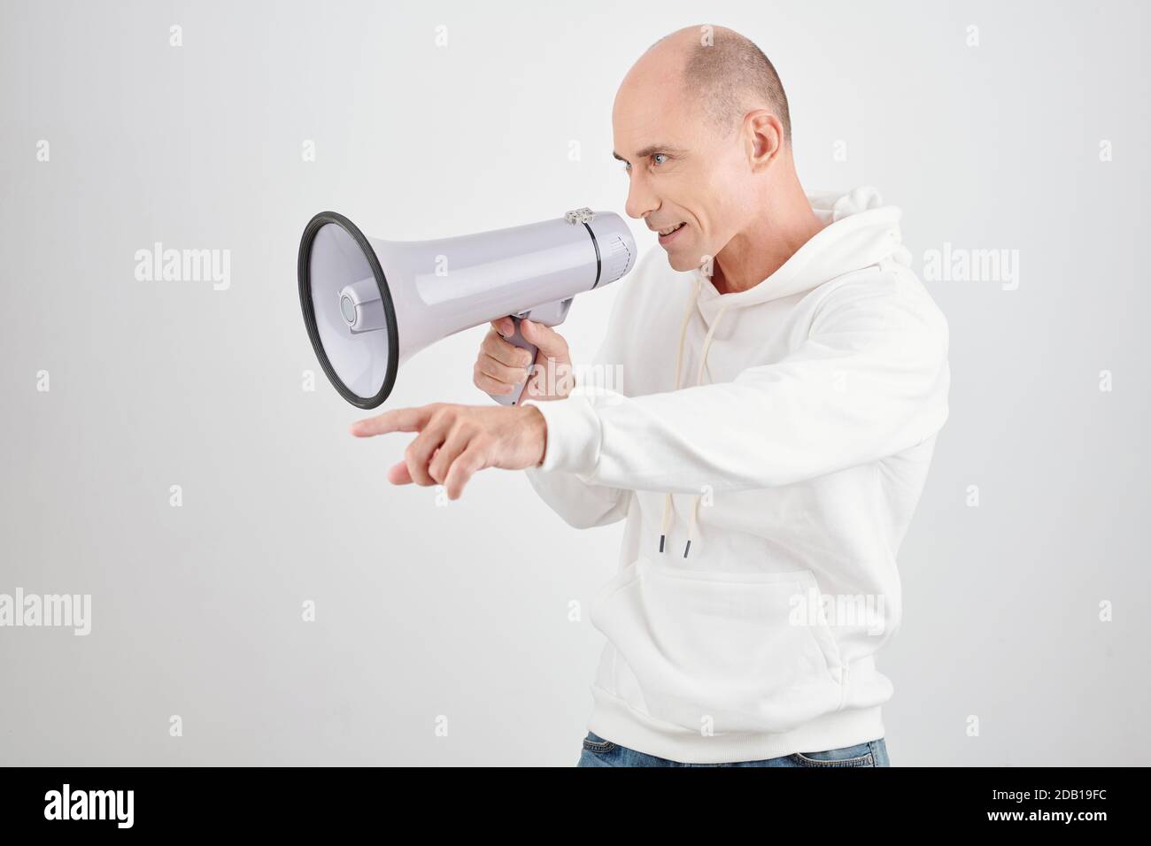 Man talking with loudspeaker Stock Photo - Alamy