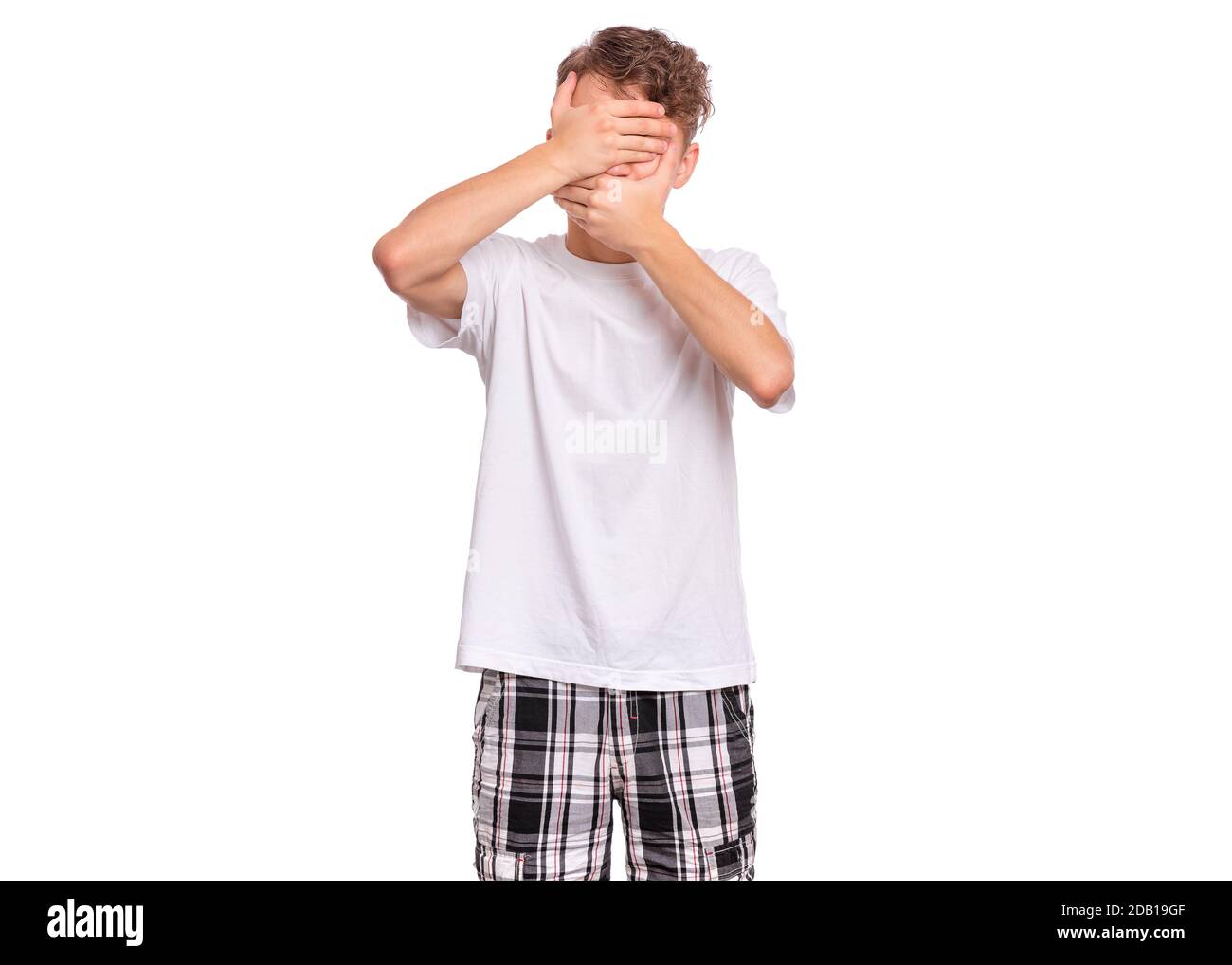 Teen boy covering face hi-res stock photography and images - Alamy