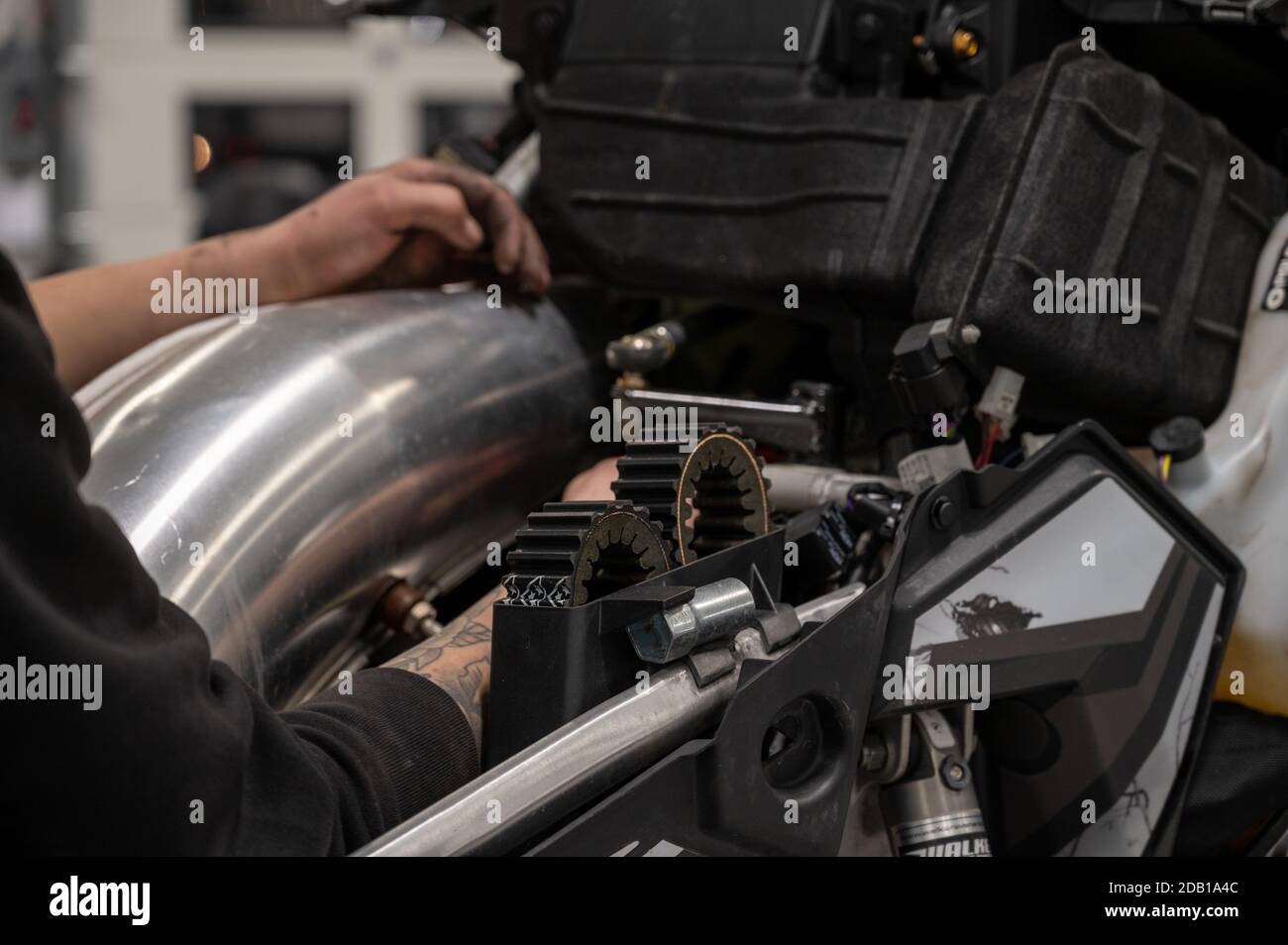 TYNSET, NORWAY - Nov 12, 2020: A mechanic fixing the engine of a ...