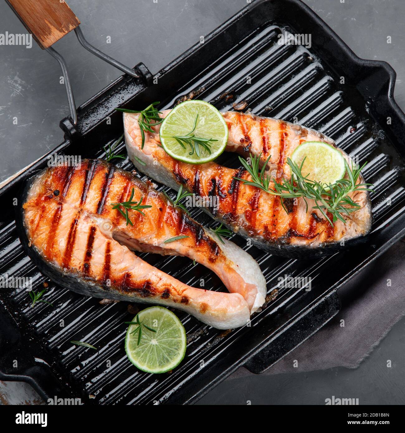 Salmon steak in a grill pan. Balanced diet. Top view Stock Photo - Alamy