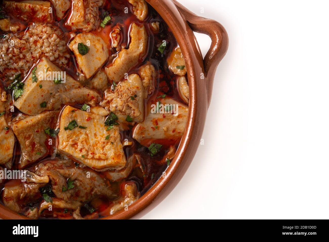 Traditional mondongo or el menudo soup isolated on white background ...