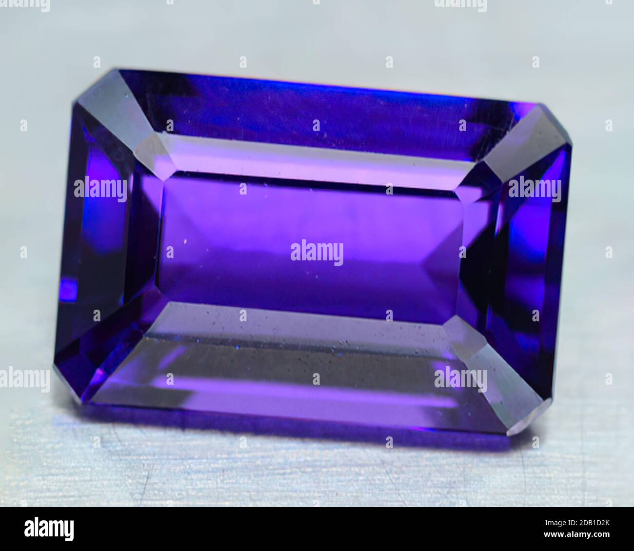 Natural amethyst on gray background Stock Photo - Alamy