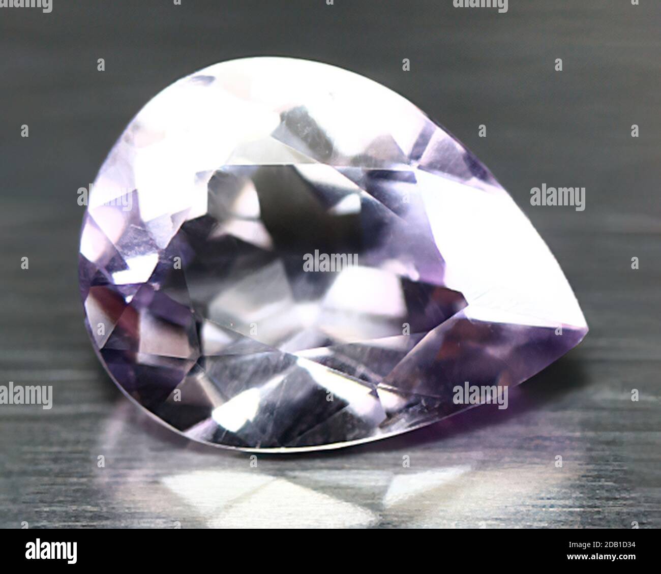 Natural amethyst on gray background Stock Photo - Alamy