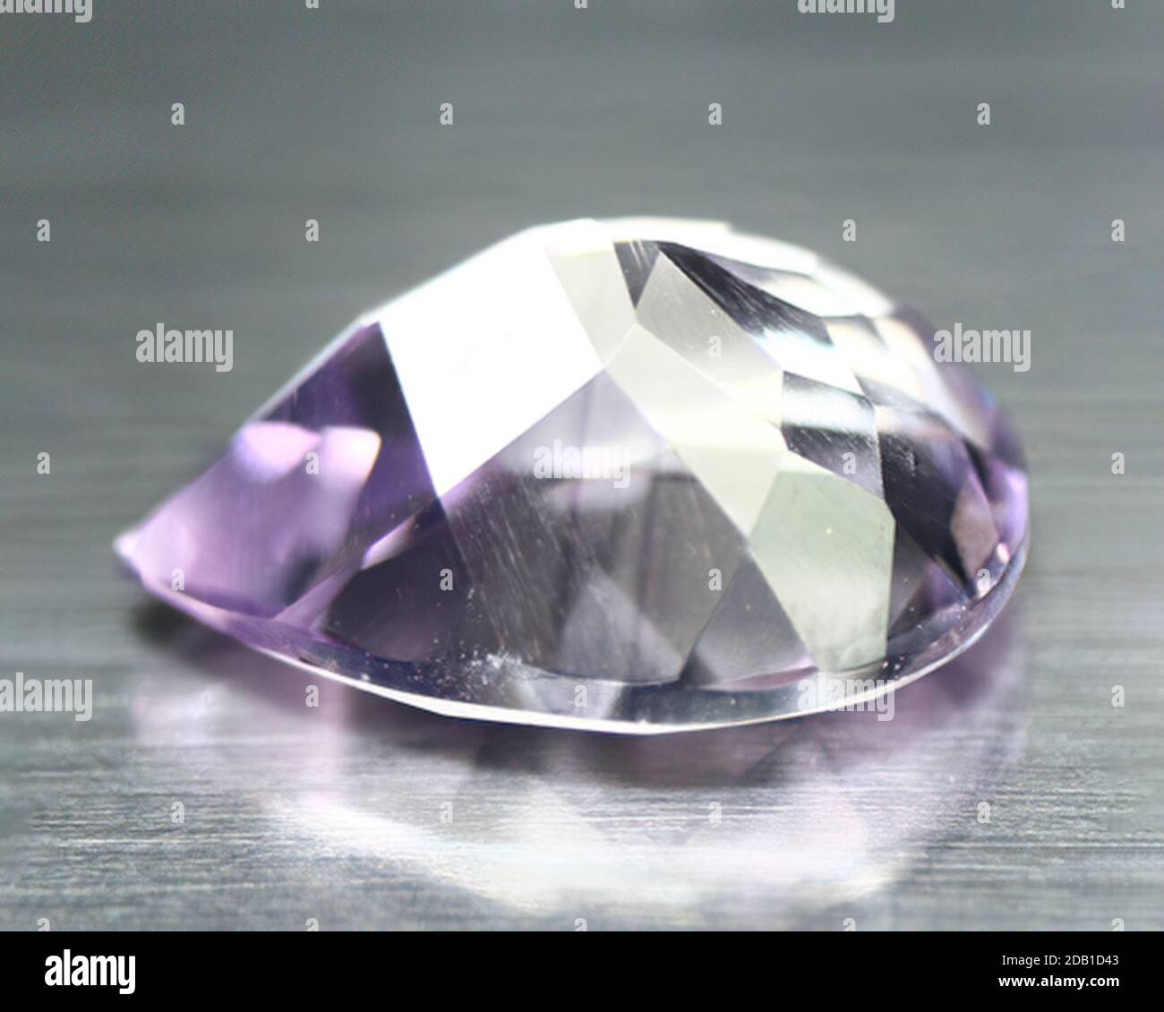 Natural amethyst on gray background Stock Photo - Alamy