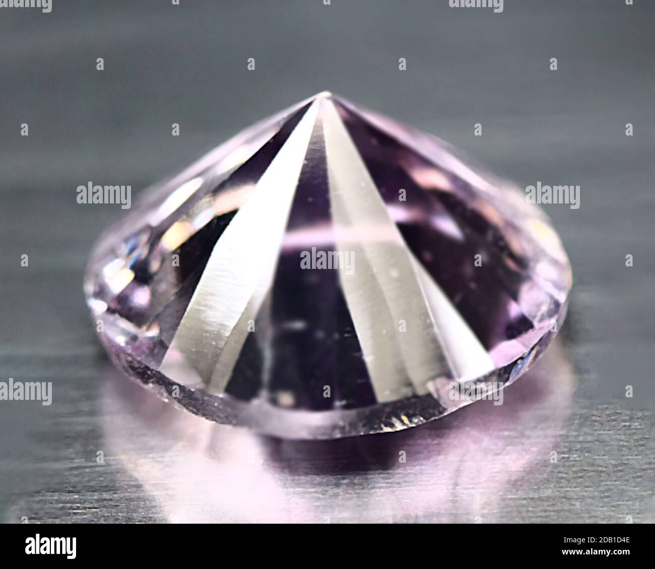 Natural amethyst on gray background Stock Photo - Alamy
