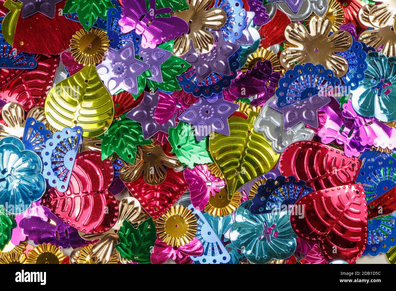 Multicolor sequins of different shapes Stock Photo - Alamy