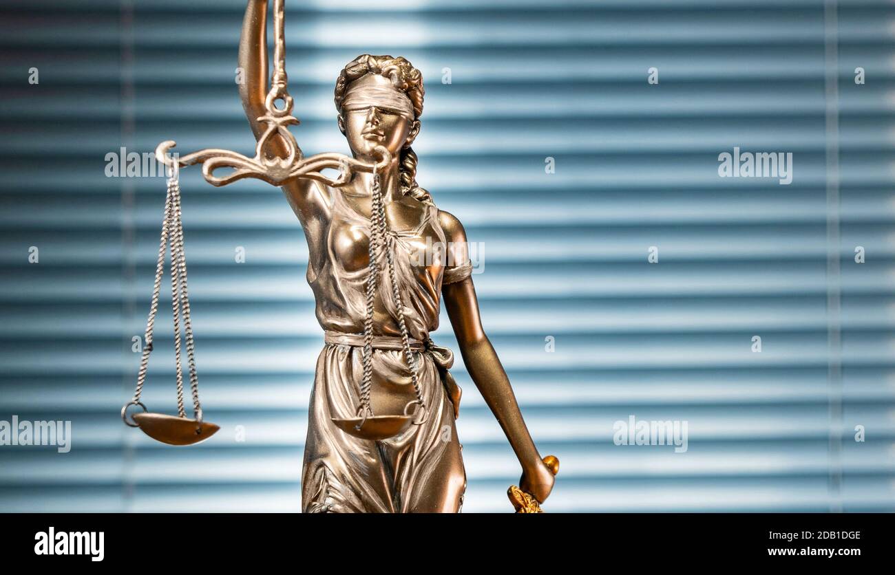 Statue of lady justice on bright background - Side view with copy space ...