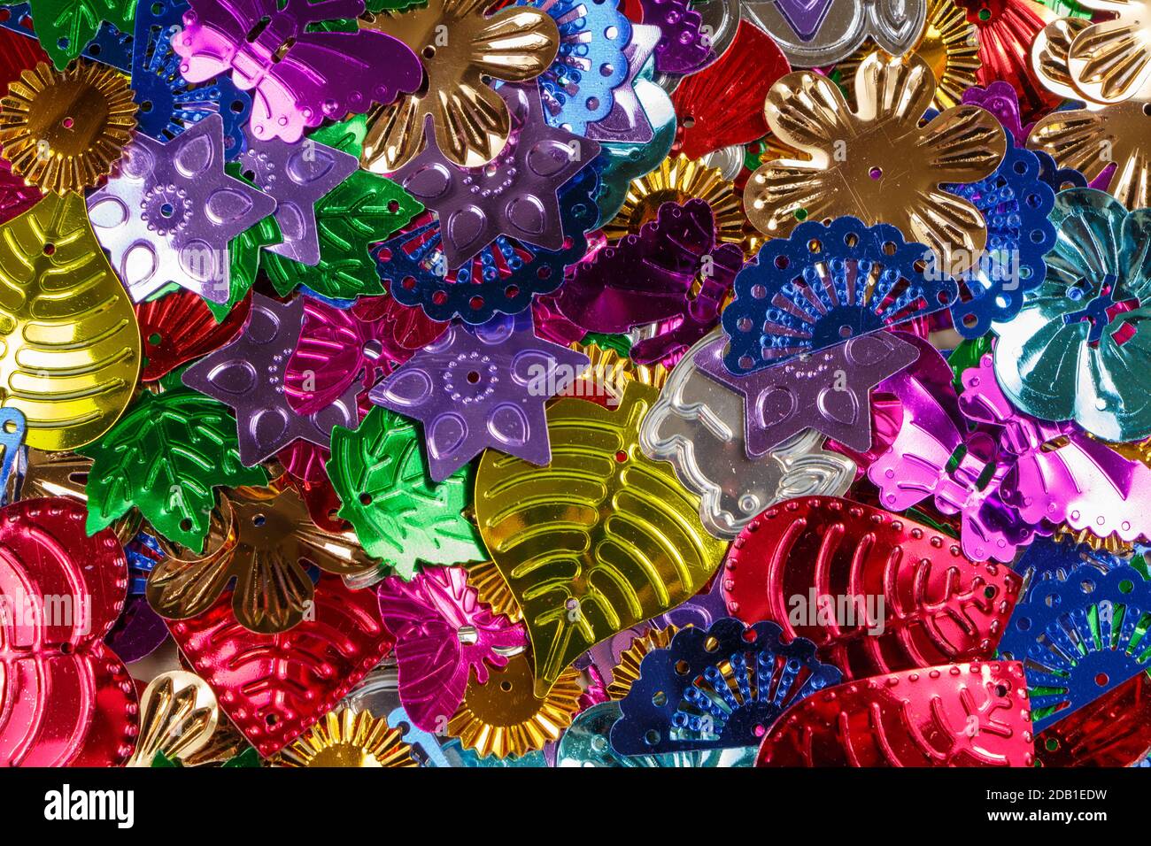 Multicolor sequins of different shapes Stock Photo - Alamy