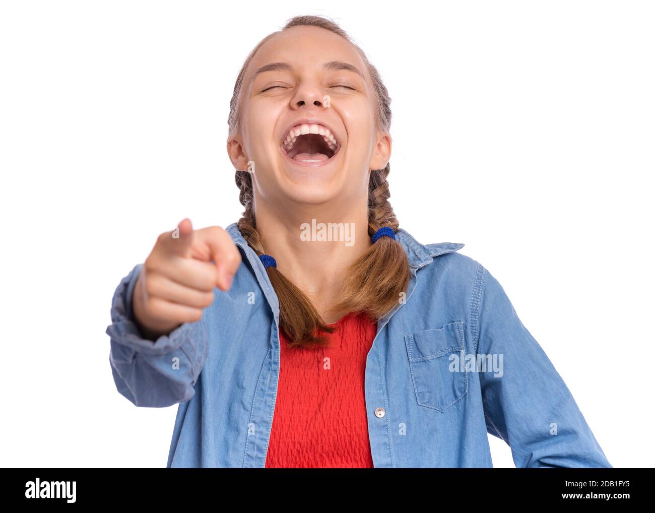 Happy teenage girl pointing up, gesturing idea or doing number one ...
