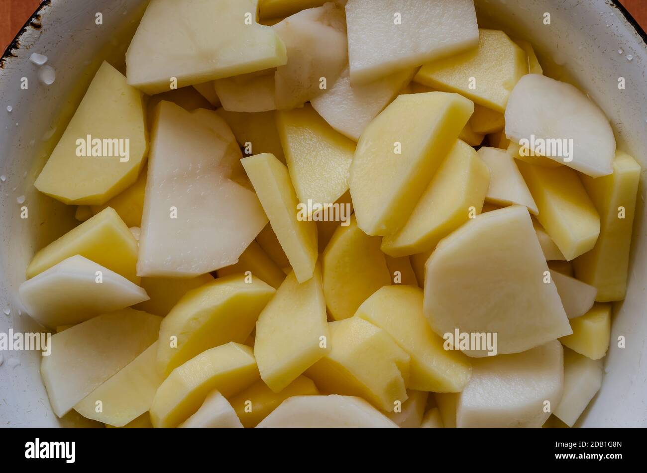 Purified raw potatoes in slices of background. Portion of uncooked ...