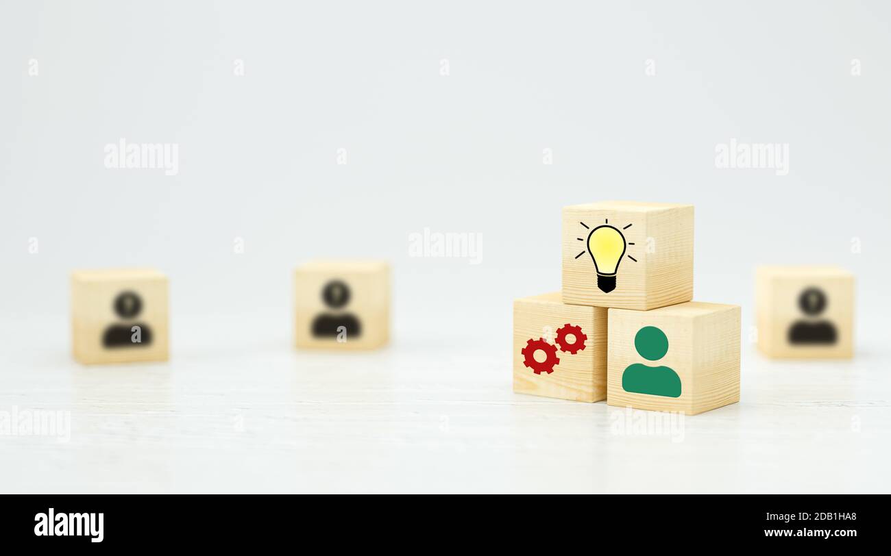 cubes showing a brainstorming session on wooden surface and white ...