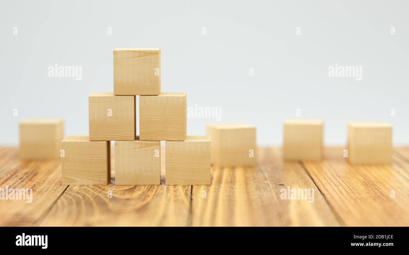 empty wooden cubes for own messages and icons on wooden floor and white ...