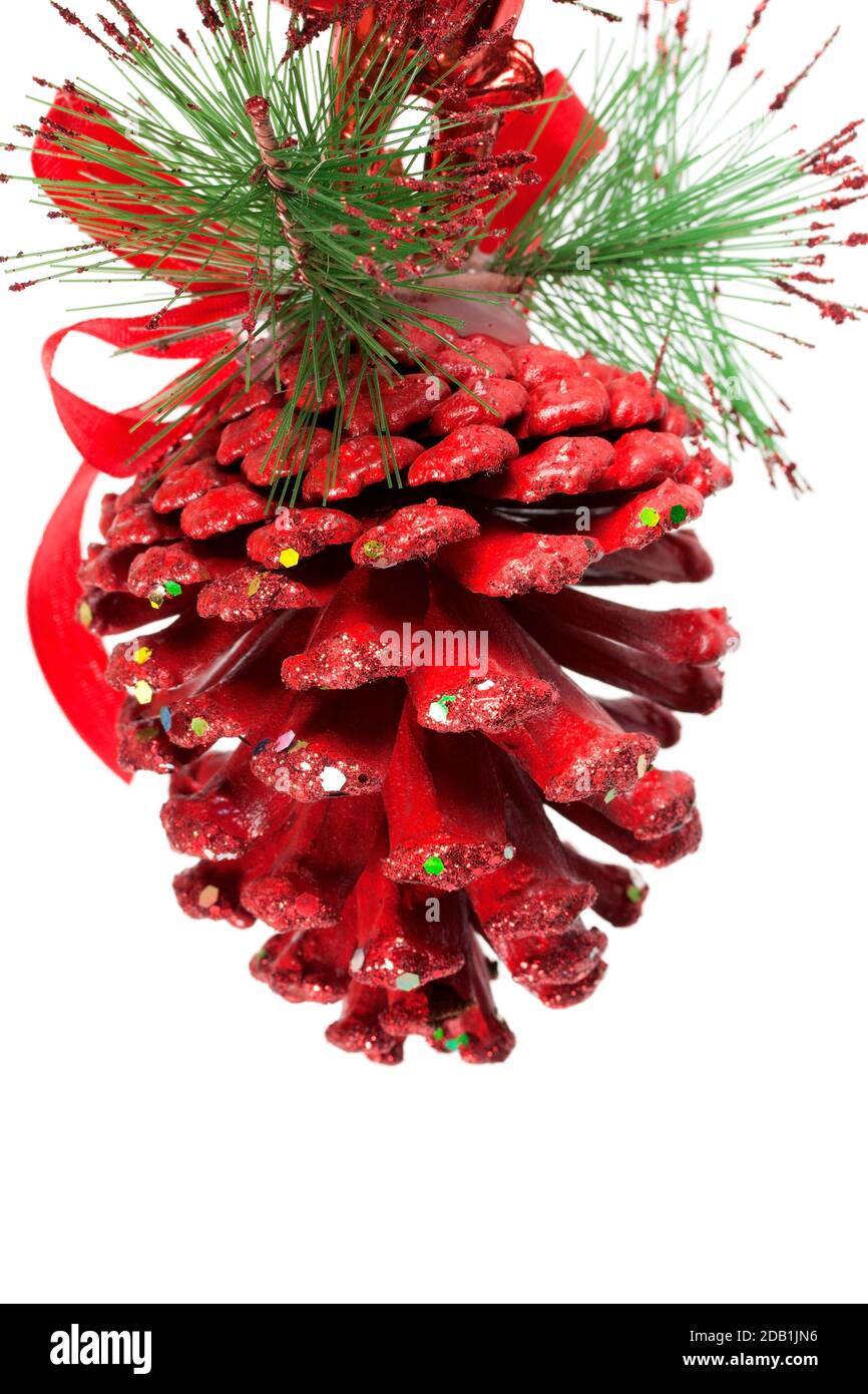 Red christmas pine cone and ribbons on white Stock Photo - Alamy