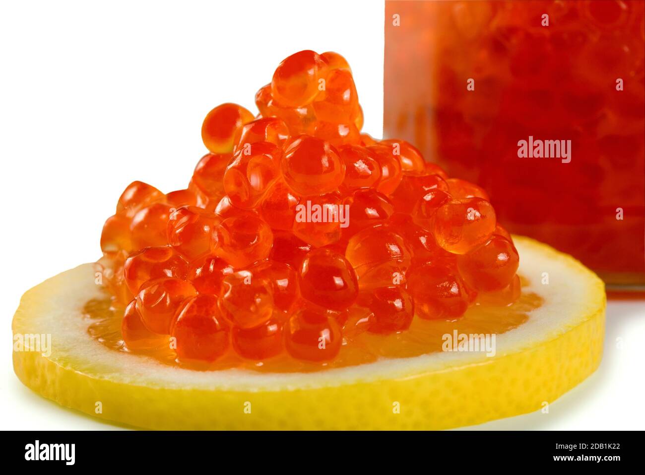 red caviar in lemon isolated on white background Stock Photo - Alamy