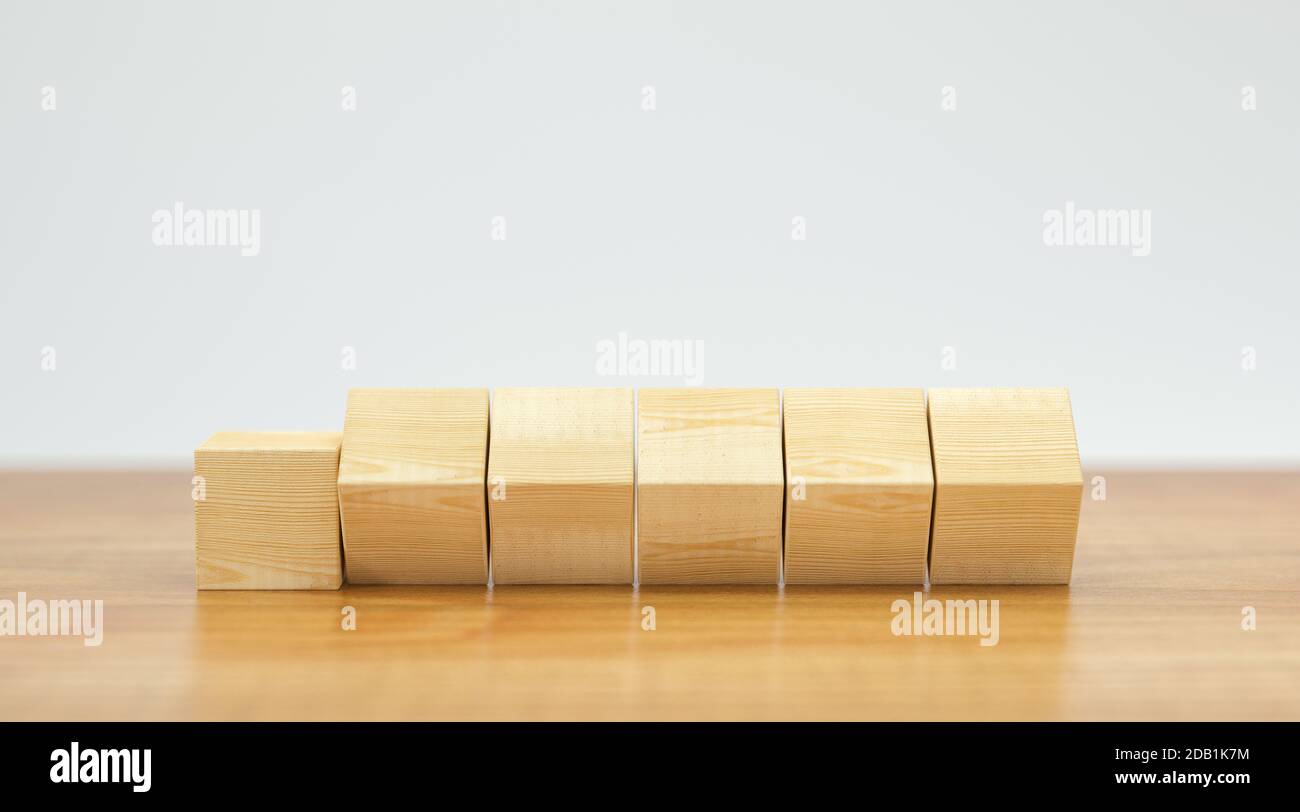 empty wooden cubes for own messages and icons on wooden floor and white ...