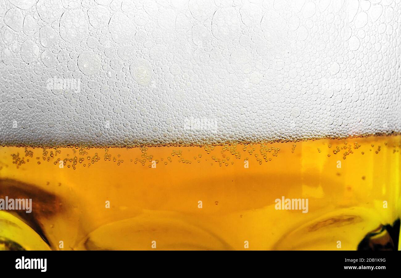 Pouring of beer - close up of beer bubbles Stock Photo - Alamy