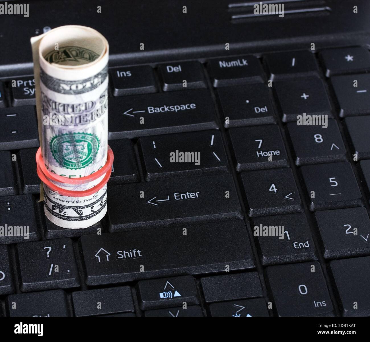 Computer keyboard and dollar money background Stock Photo - Alamy