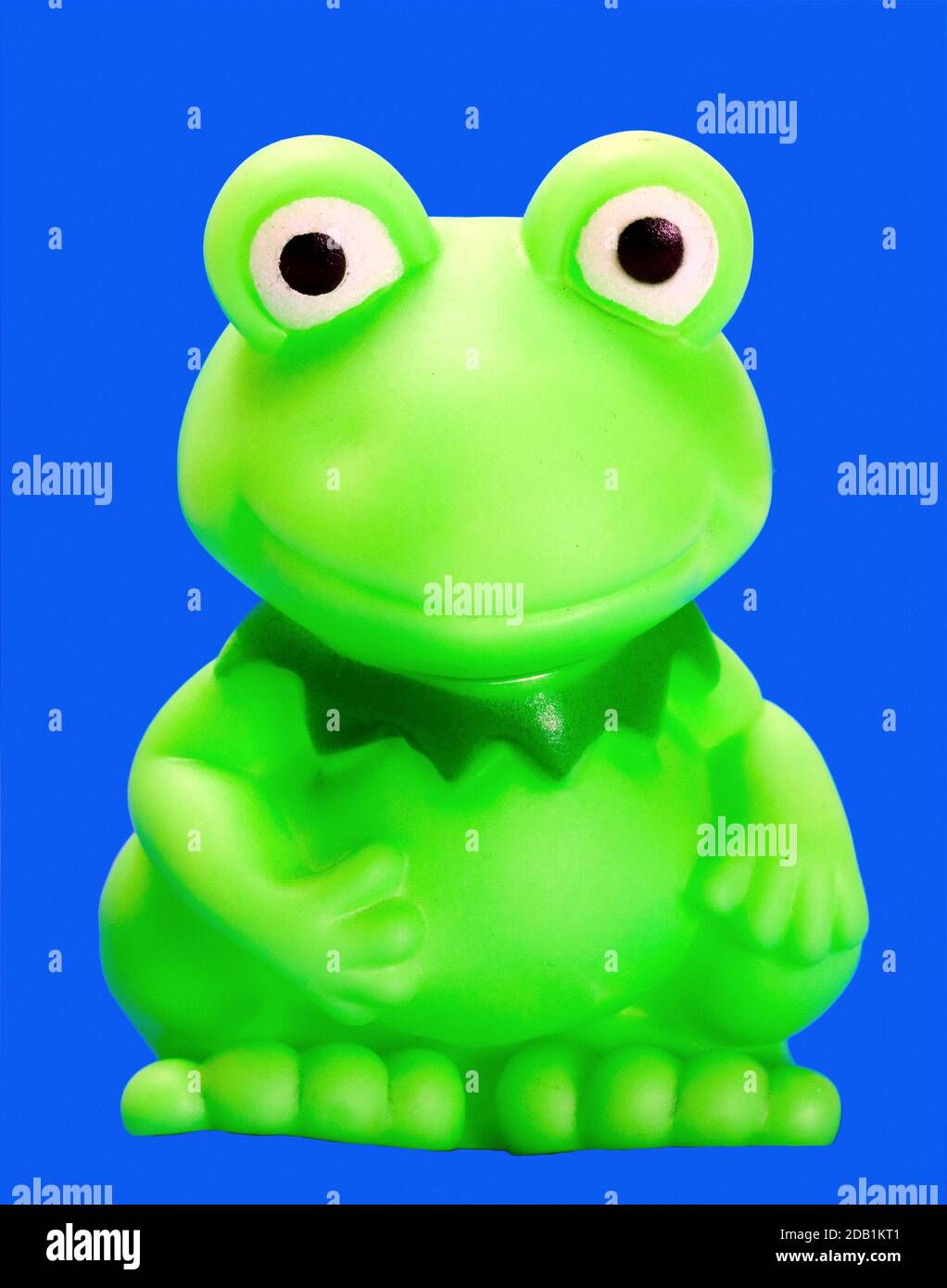 green frog rubber bath toys on blue background Stock Photo - Alamy