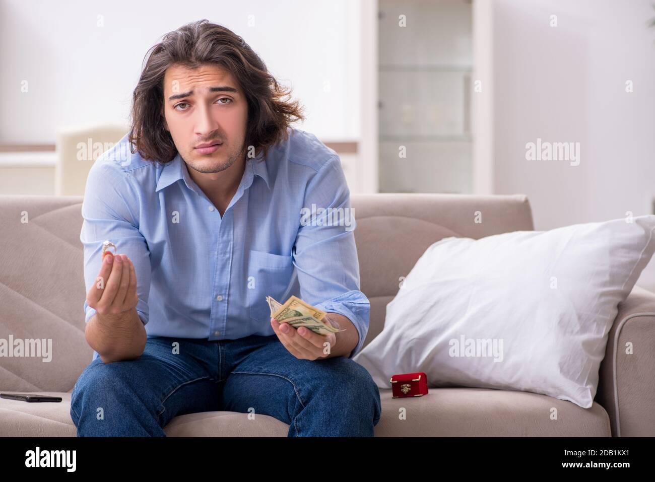 Poor man in unrequited love concept Stock Photo - Alamy