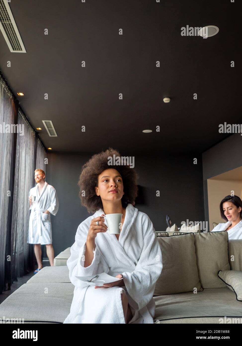Woman wearing robe drinking coffee hi-res stock photography and images ...