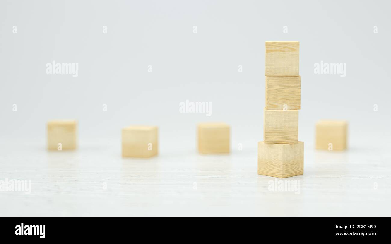 empty wooden cubes for own messages and icons on wooden floor and white ...