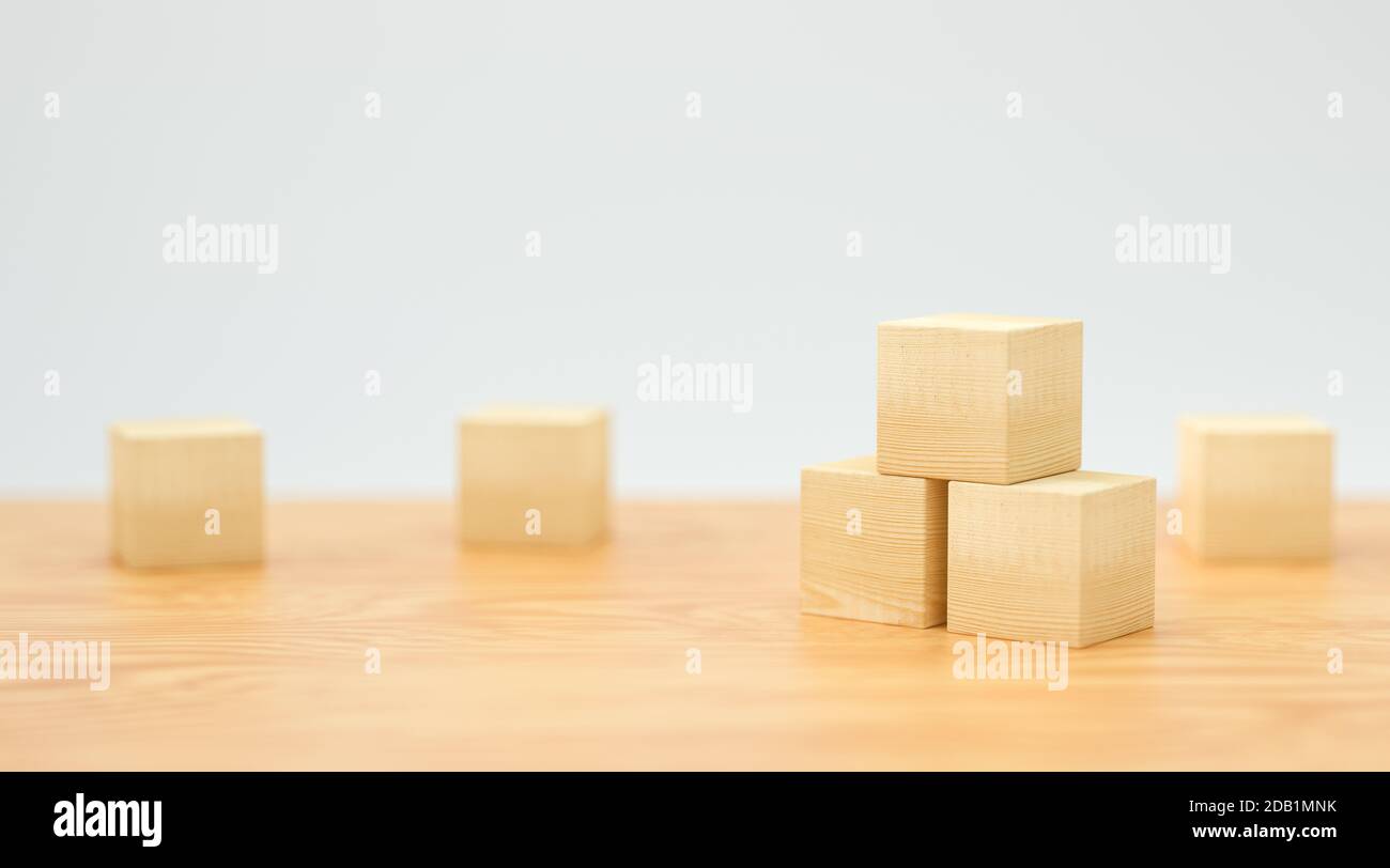 empty wooden cubes for own messages and icons on wooden floor and white ...