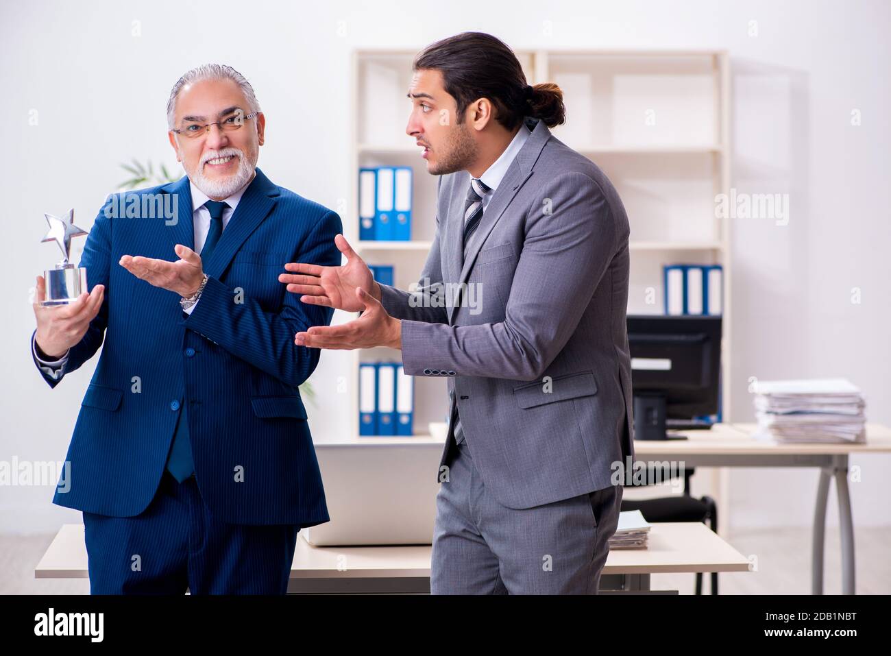 Two employees working in the office Stock Photo - Alamy