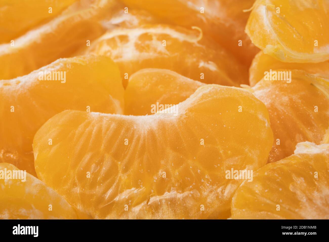 Mandarin slices close-up. Ripe and juicy parts of the fruit Stock Photo ...