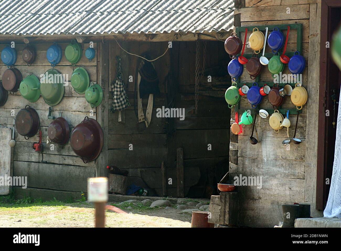 Customary display of various pots on the exterior walls of a barn in ...