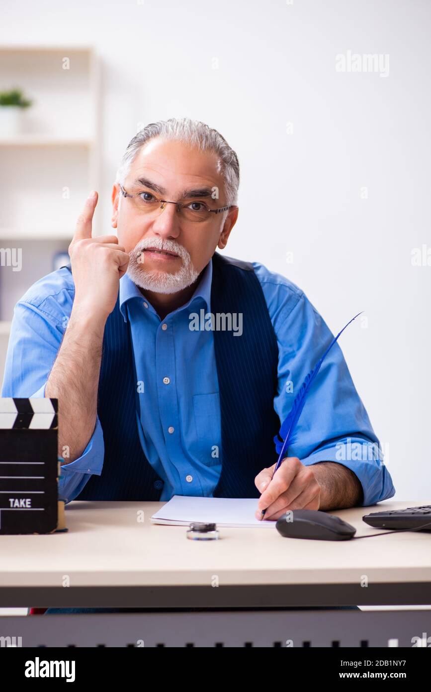 Old male author writing the screenplay Stock Photo - Alamy