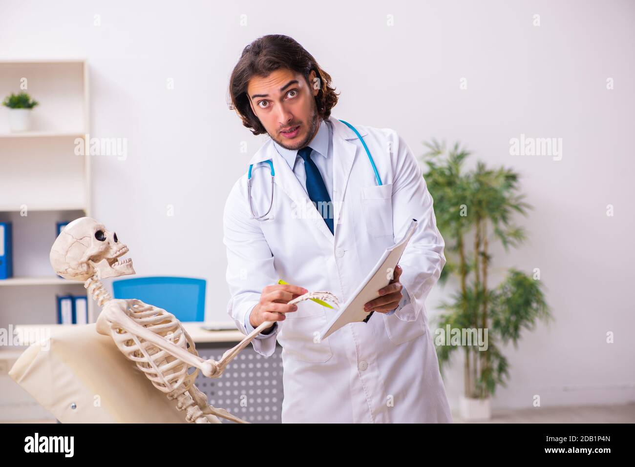 Crazy doctor examining the dead patient Stock Photo - Alamy