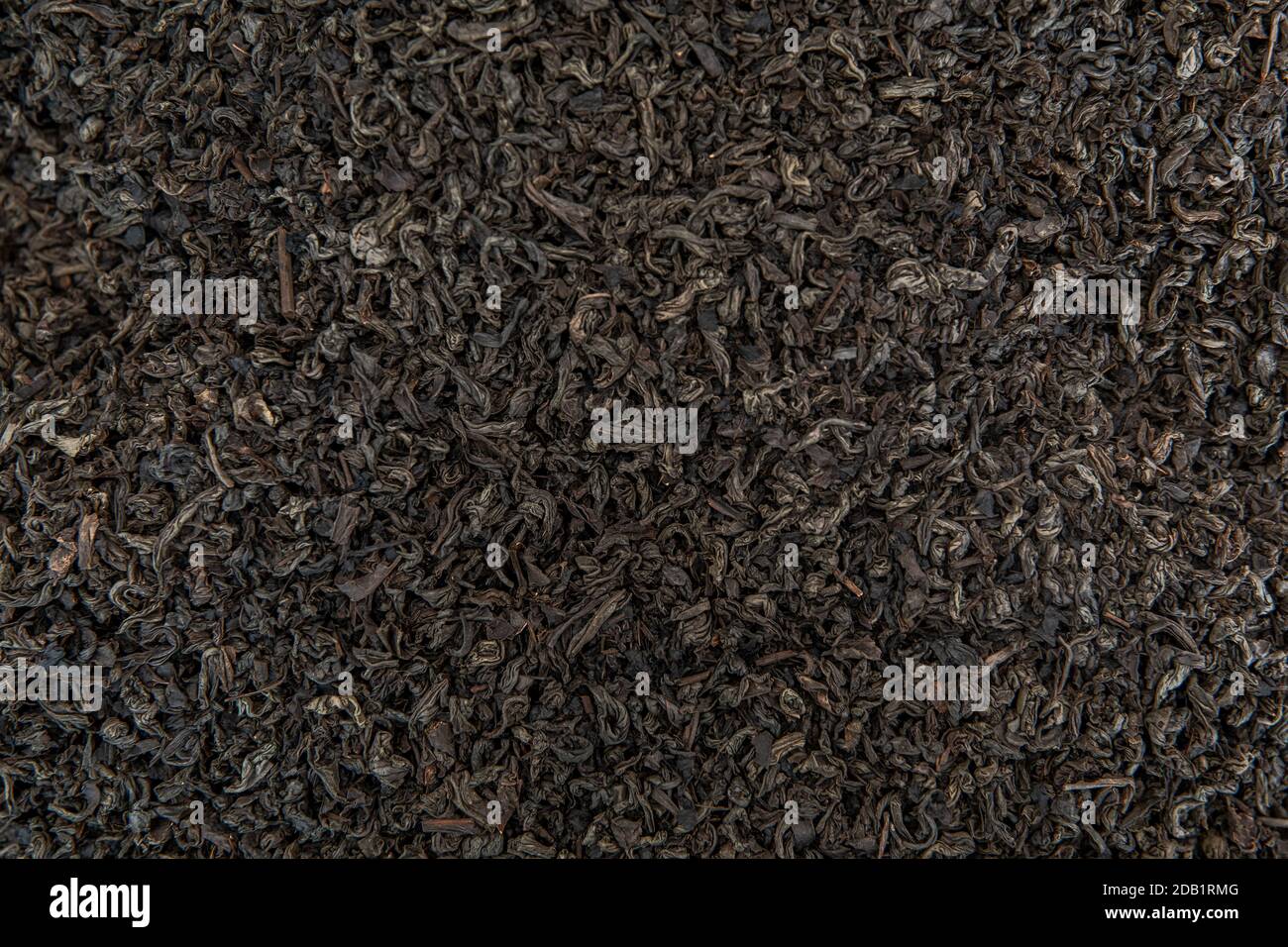 Dry black tea leaves texture background Stock Photo - Alamy