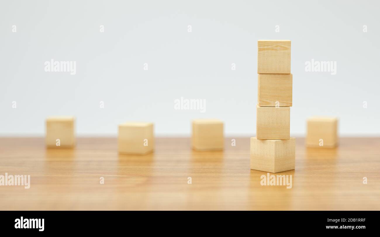 empty wooden cubes for own messages and icons on wooden floor and white ...