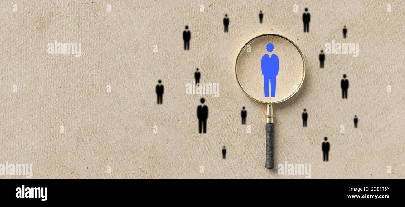 magnifying glass highlighting a person icon in a group of peoples on ...