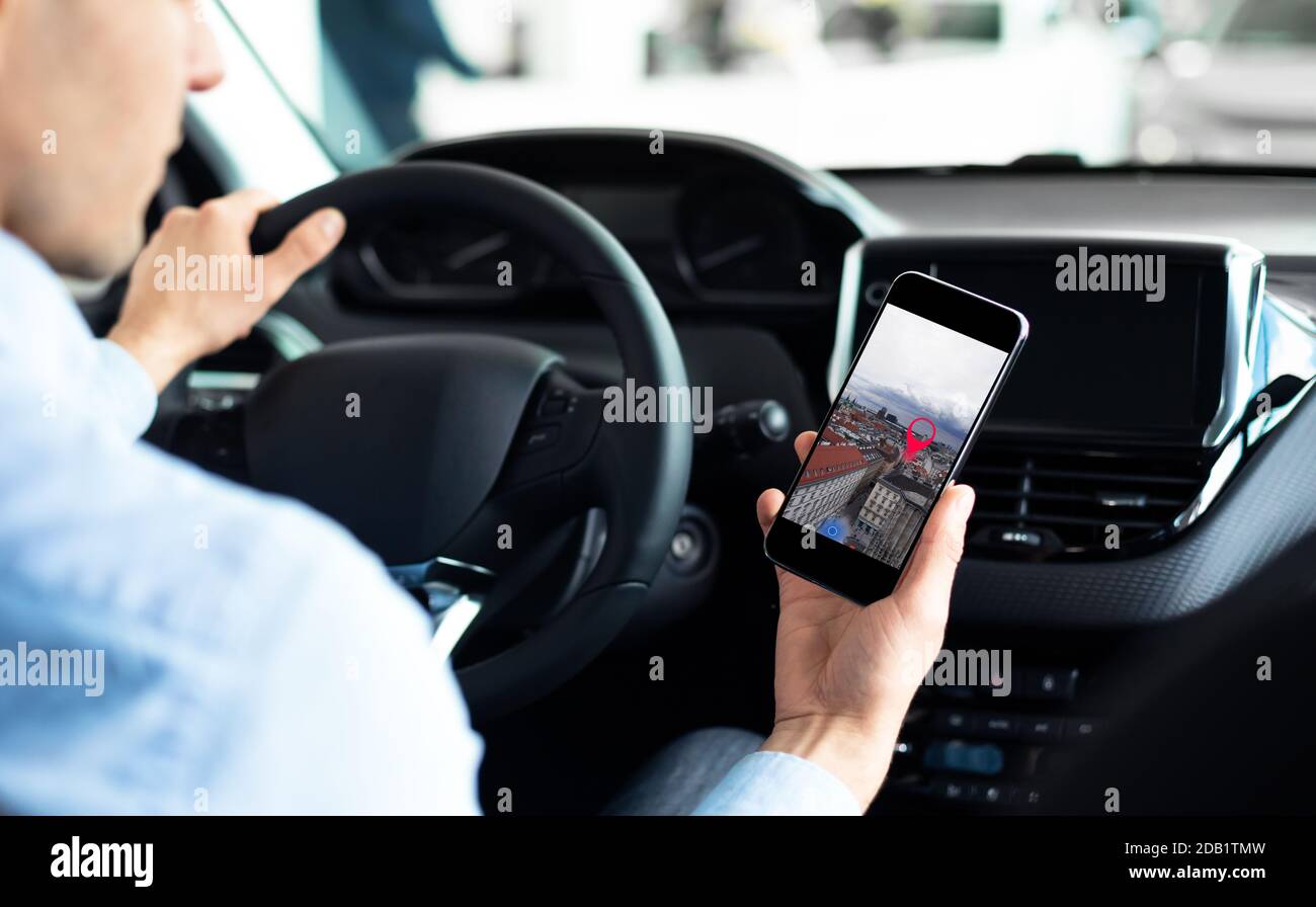 Man Driving Car Using Phone With Mobile Navigation Application Stock ...