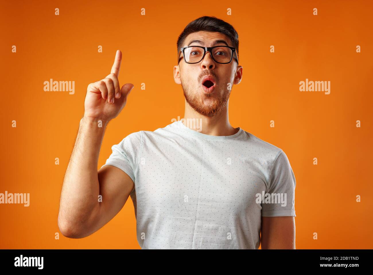 Young man putting his finger up hi-res stock photography and images - Alamy