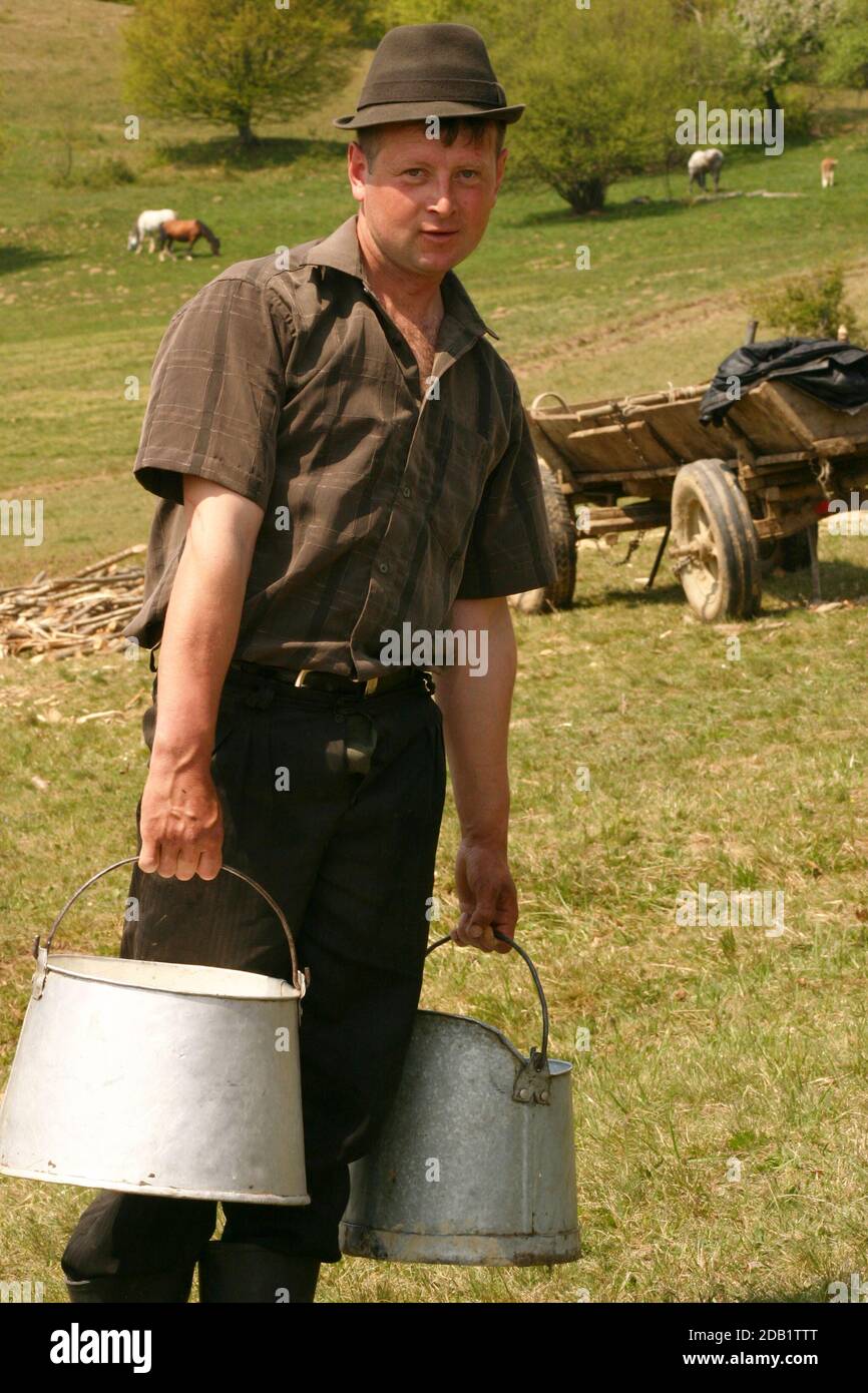 Man carrying buckets hi-res stock photography and images - Alamy