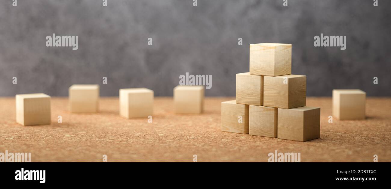 empty wooden cubes for own messages and icons on cork floor in front of ...