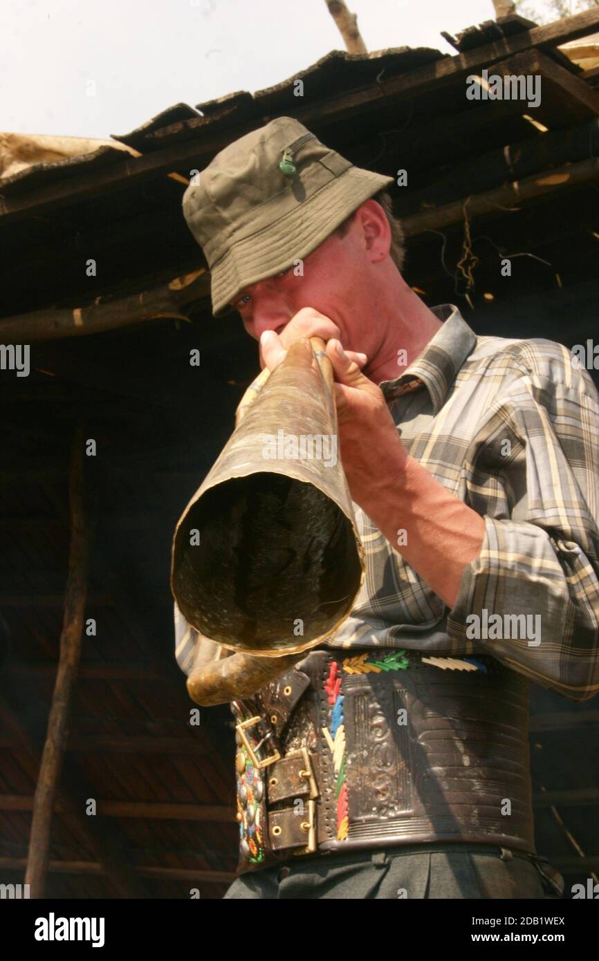 Man in Romania's countryside with a handcrafted bugle Stock Photo - Alamy