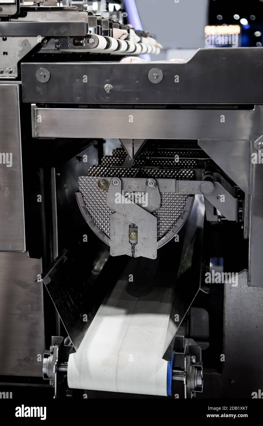 Automatic meat weight sorting machine in food industry Stock Photo - Alamy