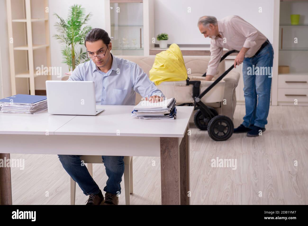 Grandparent looking after infant hi-res stock photography and images ...