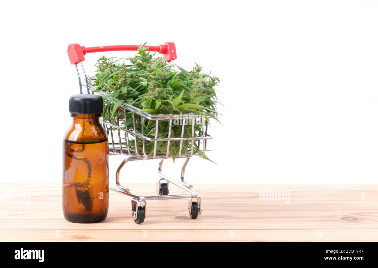cannabis with cannabidiol (cbd) extract on table Stock Photo - Alamy