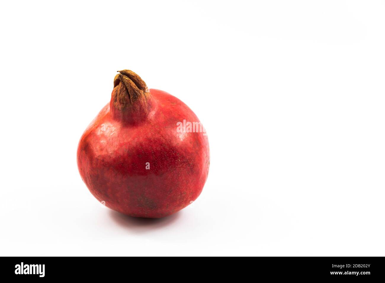 A series of photos with pomegranate on a white isolated background with ...