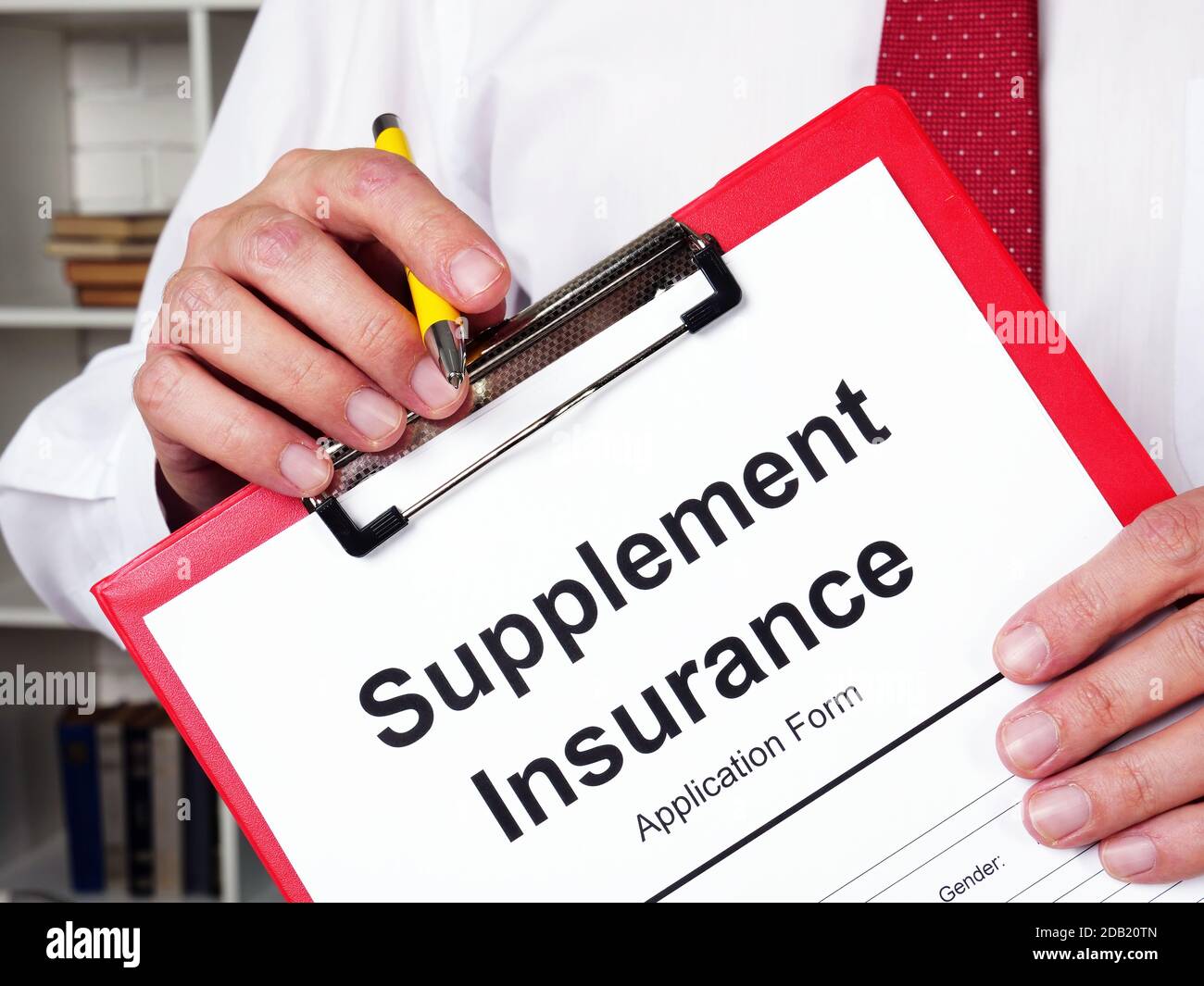 Supplement insurance form and insurer with pen Stock Photo - Alamy